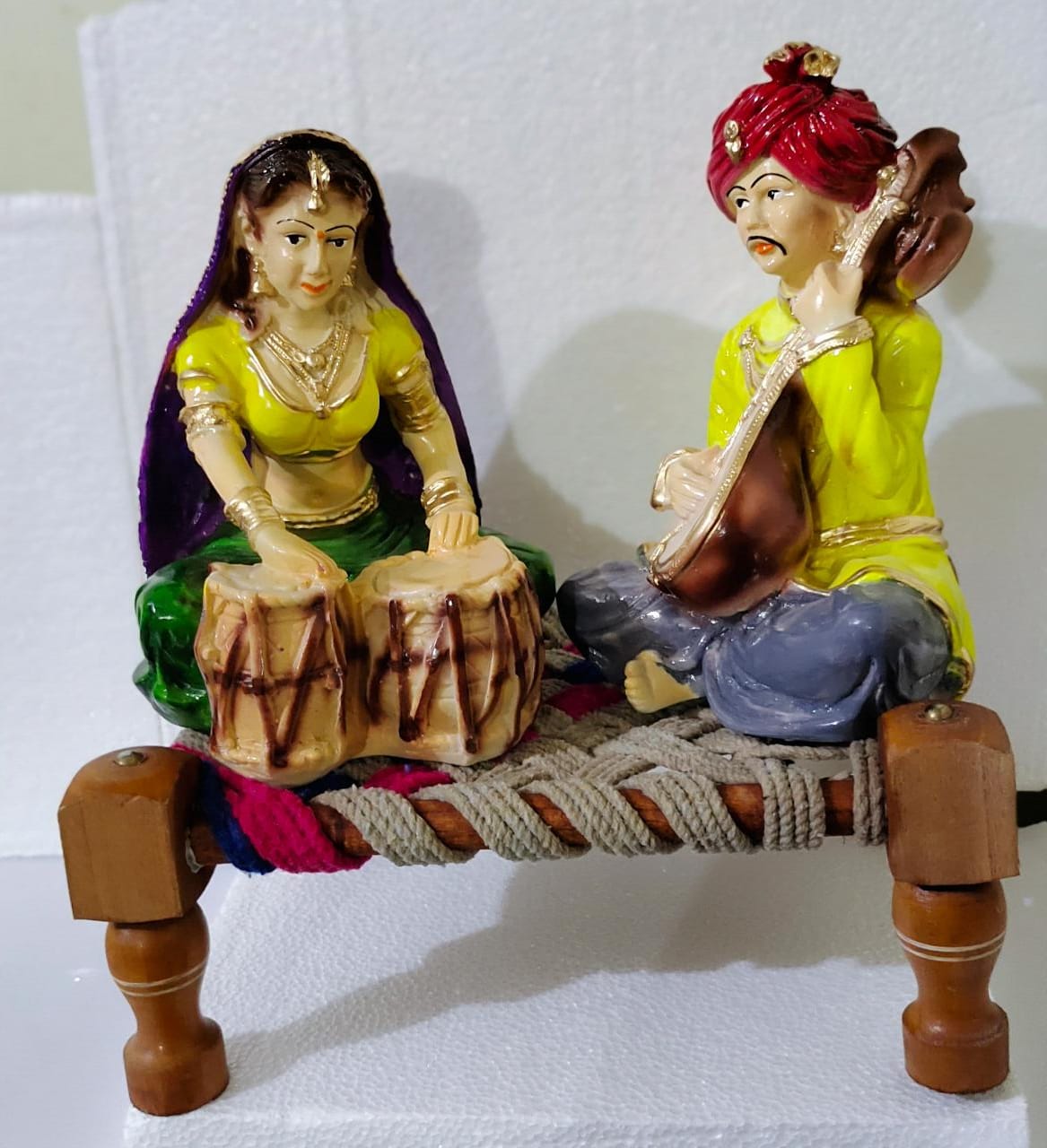 Rajasthani Couple Statue playing musical instruments sitting on Khat ...